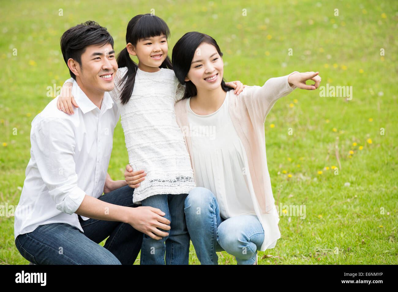 Happy young family with one child Stock Photo - Alamy
