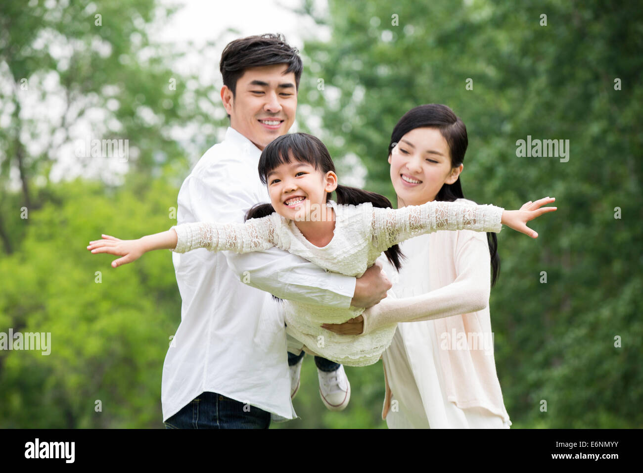 Happy young family with one child Stock Photo - Alamy