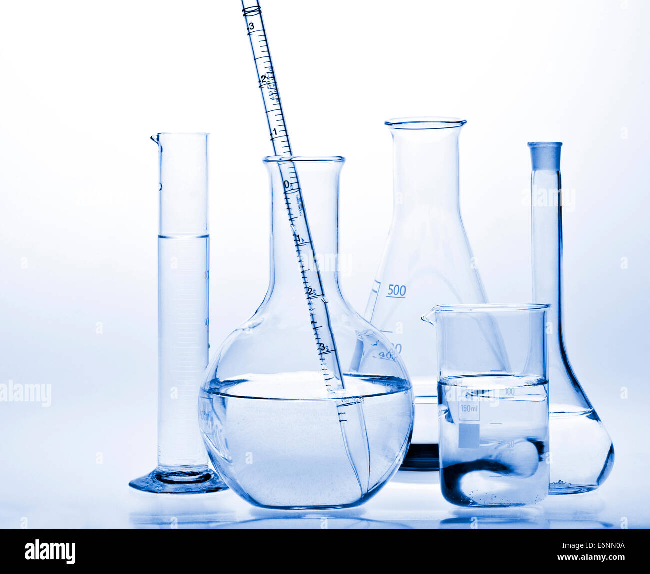 Test-tubes with reflections on a white and blue background. Laboratory ...