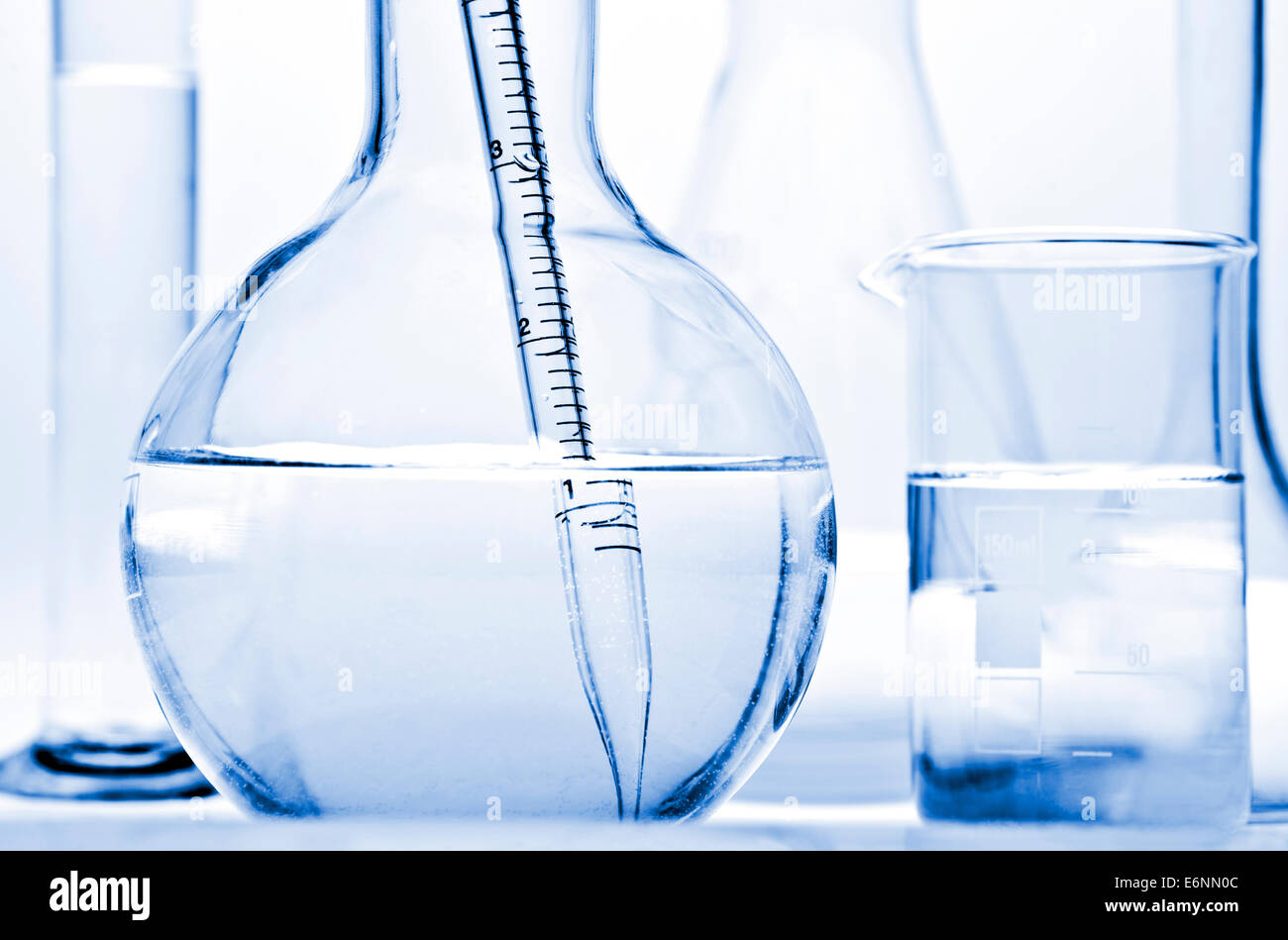 Test-tubes with reflections on a white and blue background. Laboratory ...