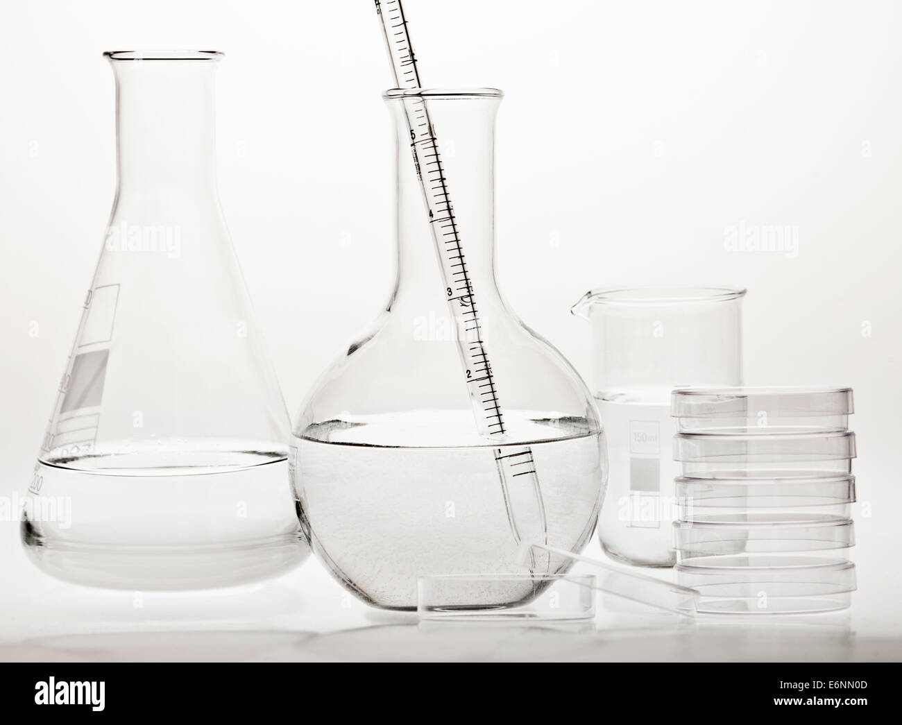 Test-tubes with reflections on a white background. Laboratory glassware ...