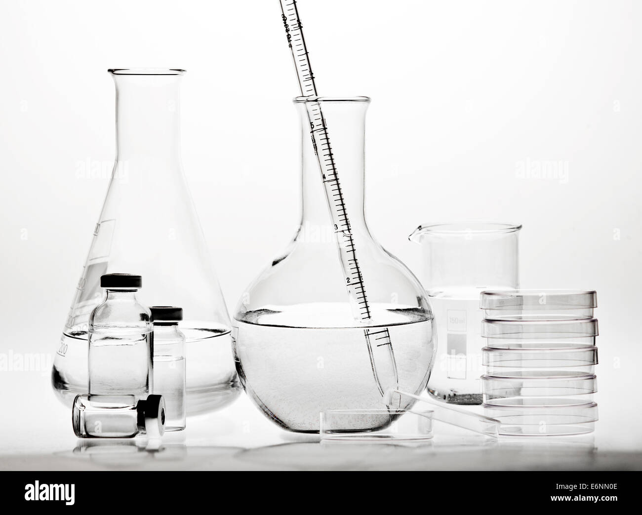 Test-tubes with reflections on a white background. Laboratory glassware ...