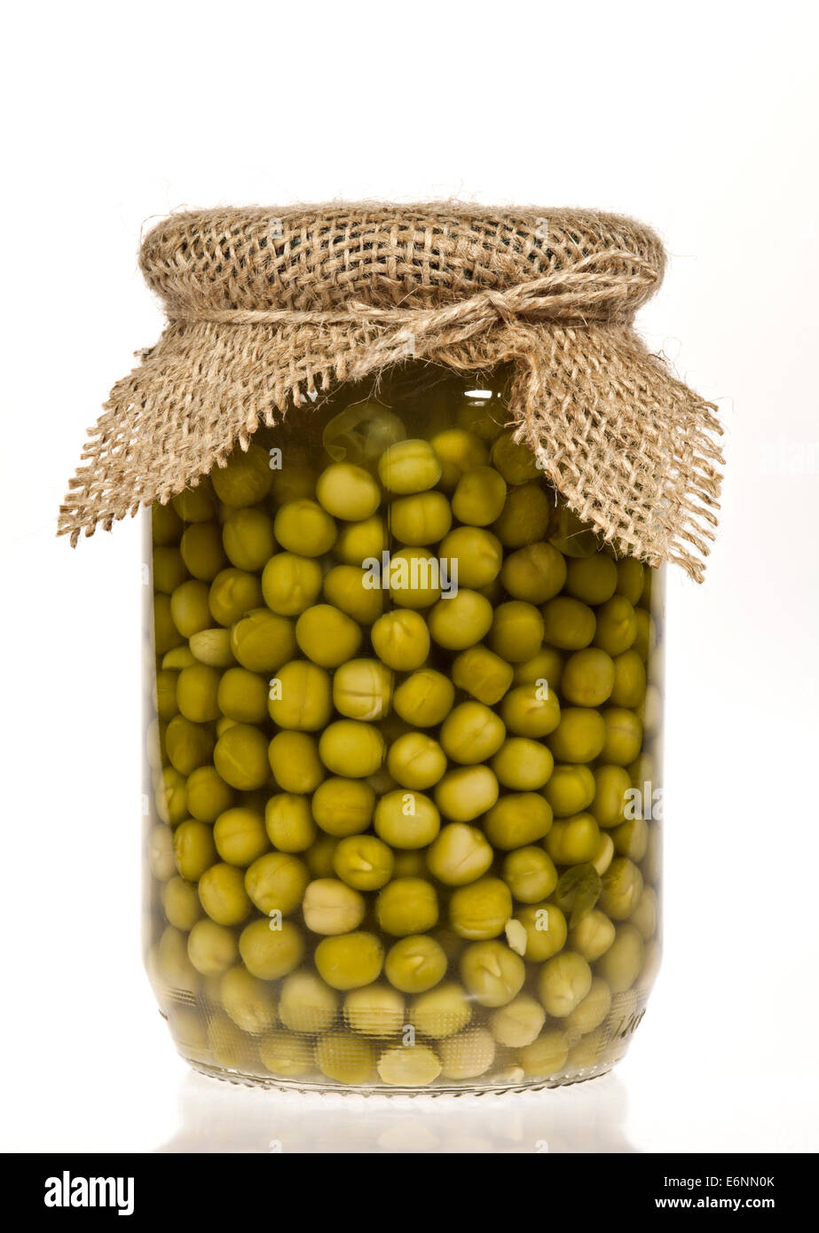 Glass jar of preserved peas on a white background Stock Photo - Alamy