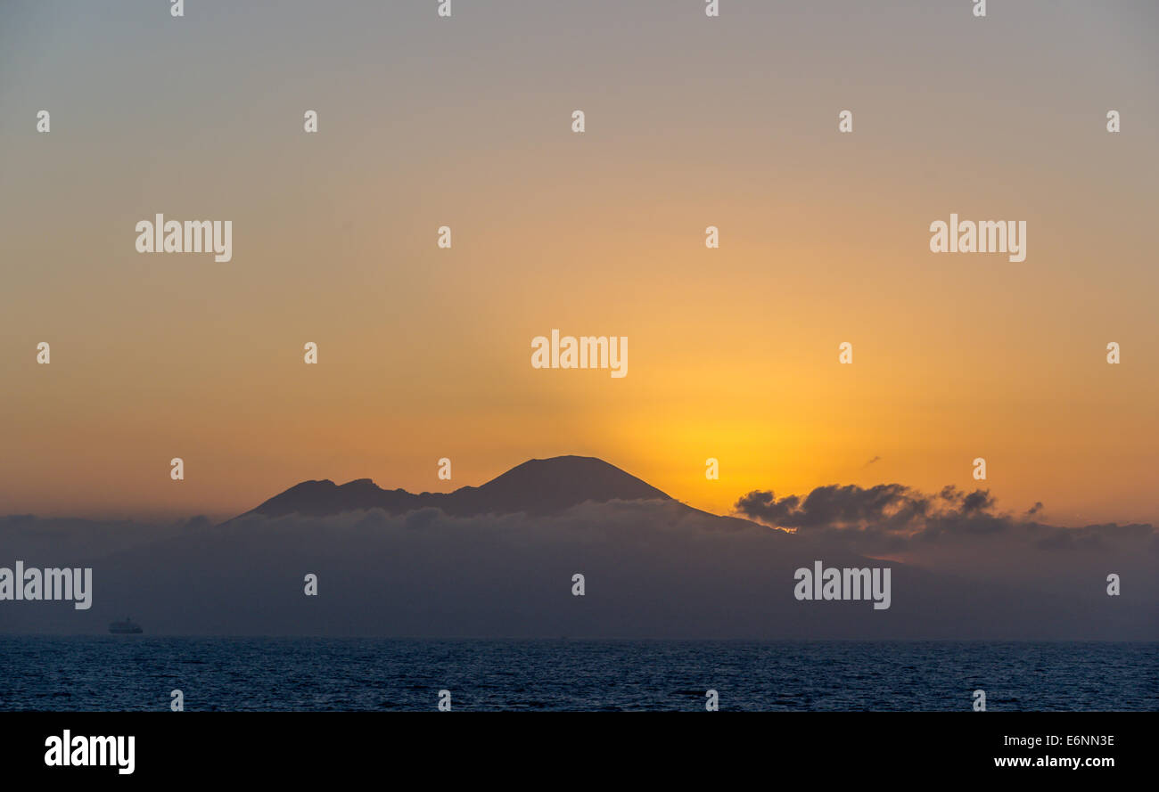 Sun rise over Mount Vesuvius the active volcano from the Bay of Naples ...