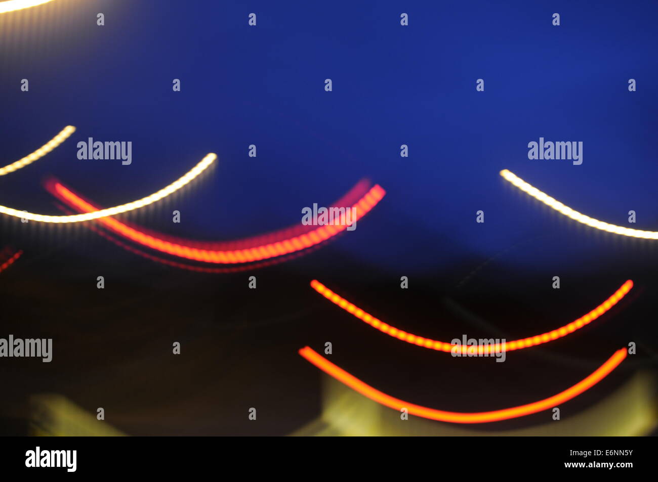 different coloured curved light trails Stock Photo - Alamy