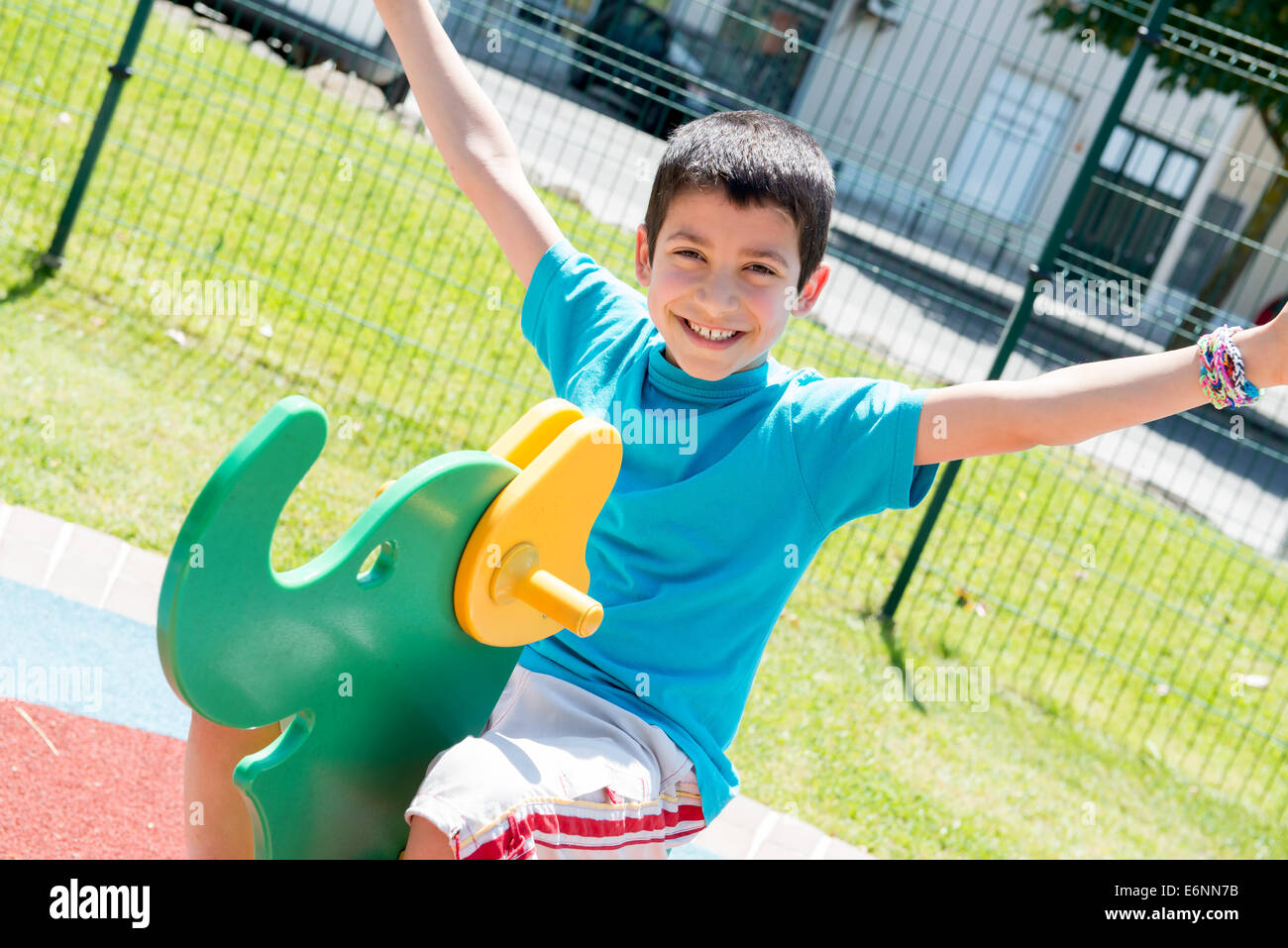 Young boy playing in the park Stock Photo - Alamy