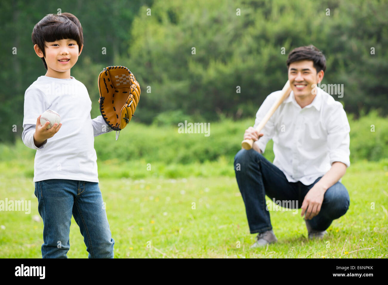 Father and son playing baseball Stock Photo - Alamy