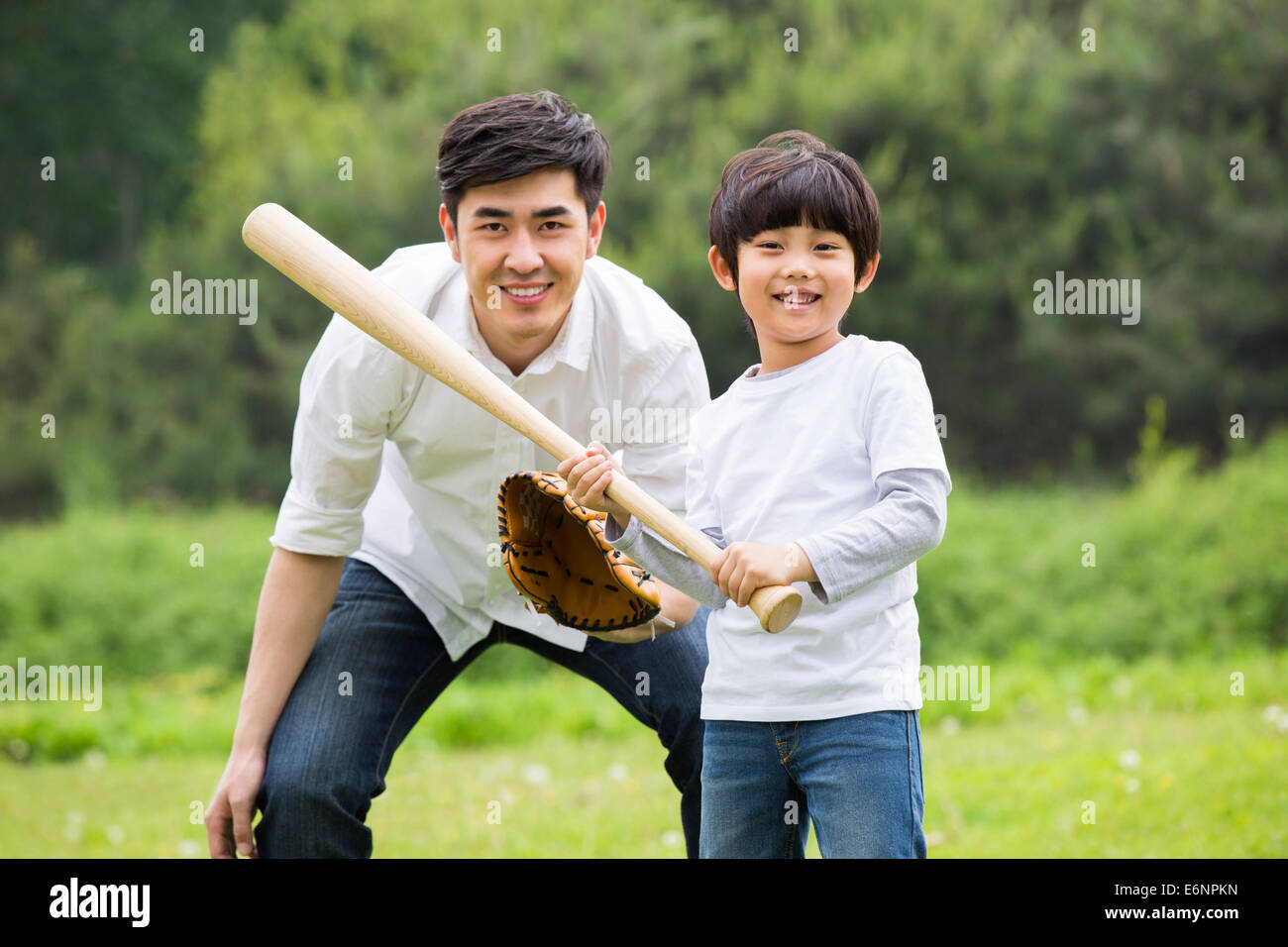 Father and son playing baseball Stock Photo - Alamy