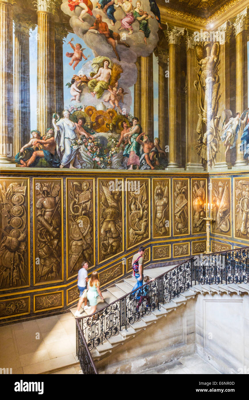 Tourists visiting The Kings Staircase Hampton Court Palace London ...