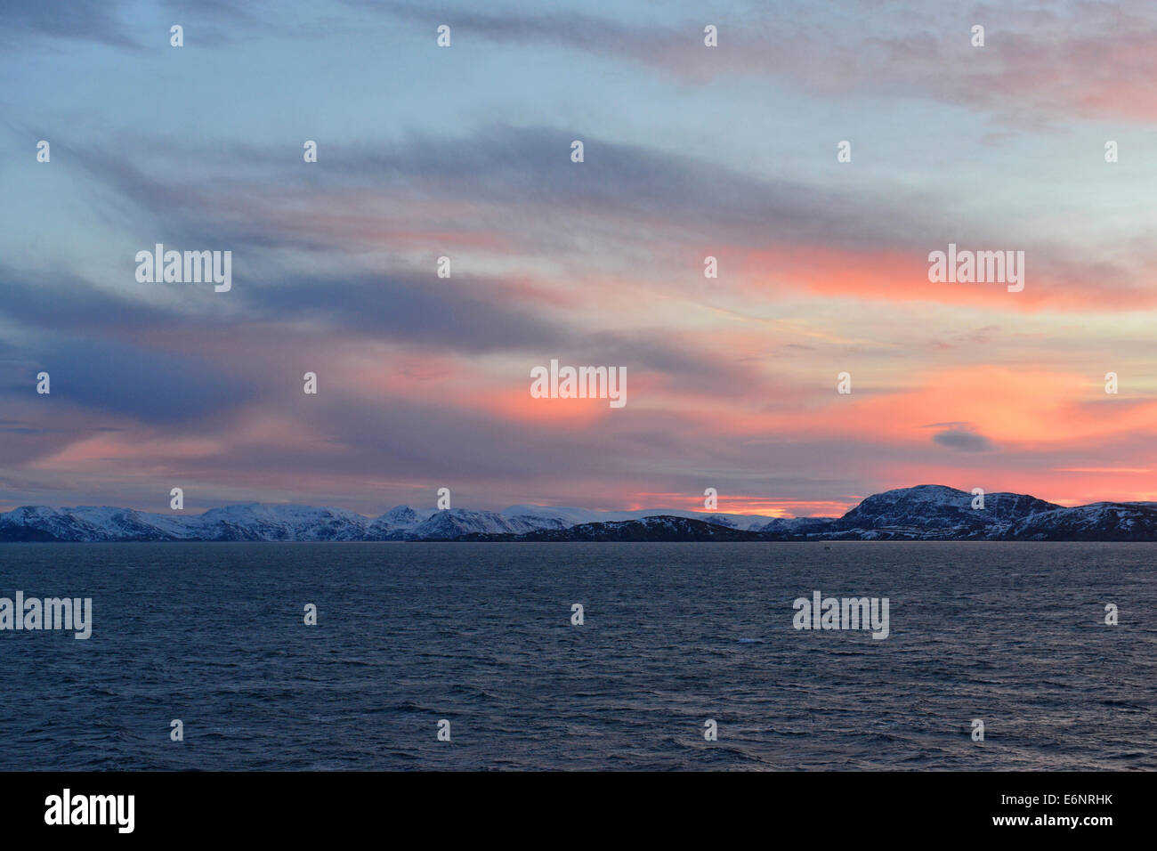 Norwegian Sea with coastal strip in the red light of the morning, 23 ...