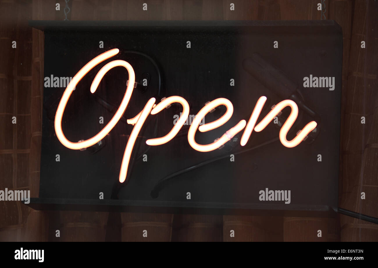 A neon open sign in the window of a store Stock Photo - Alamy