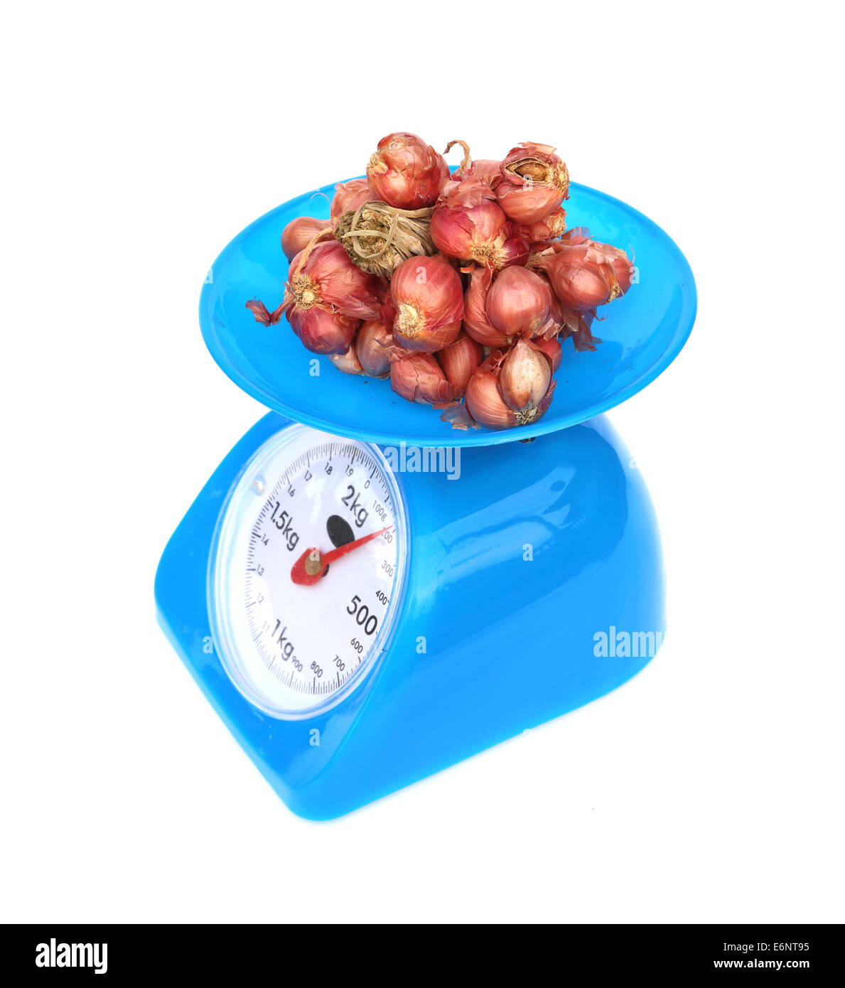 kitchen scales and onions isolated on white background Stock Photo - Alamy