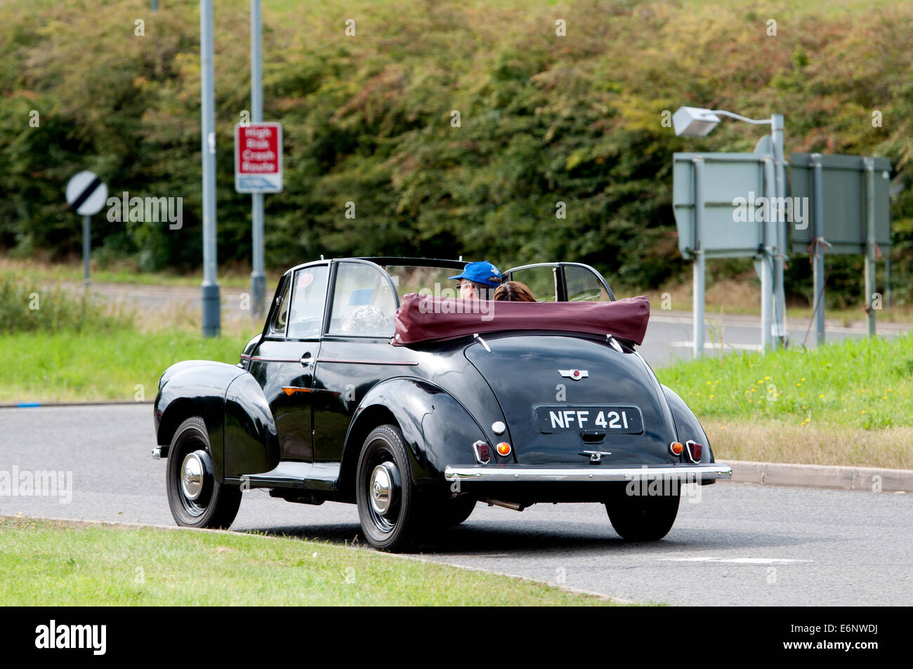 1953 Morris Minor convertible (split screen) car on the Fosse Way road ...