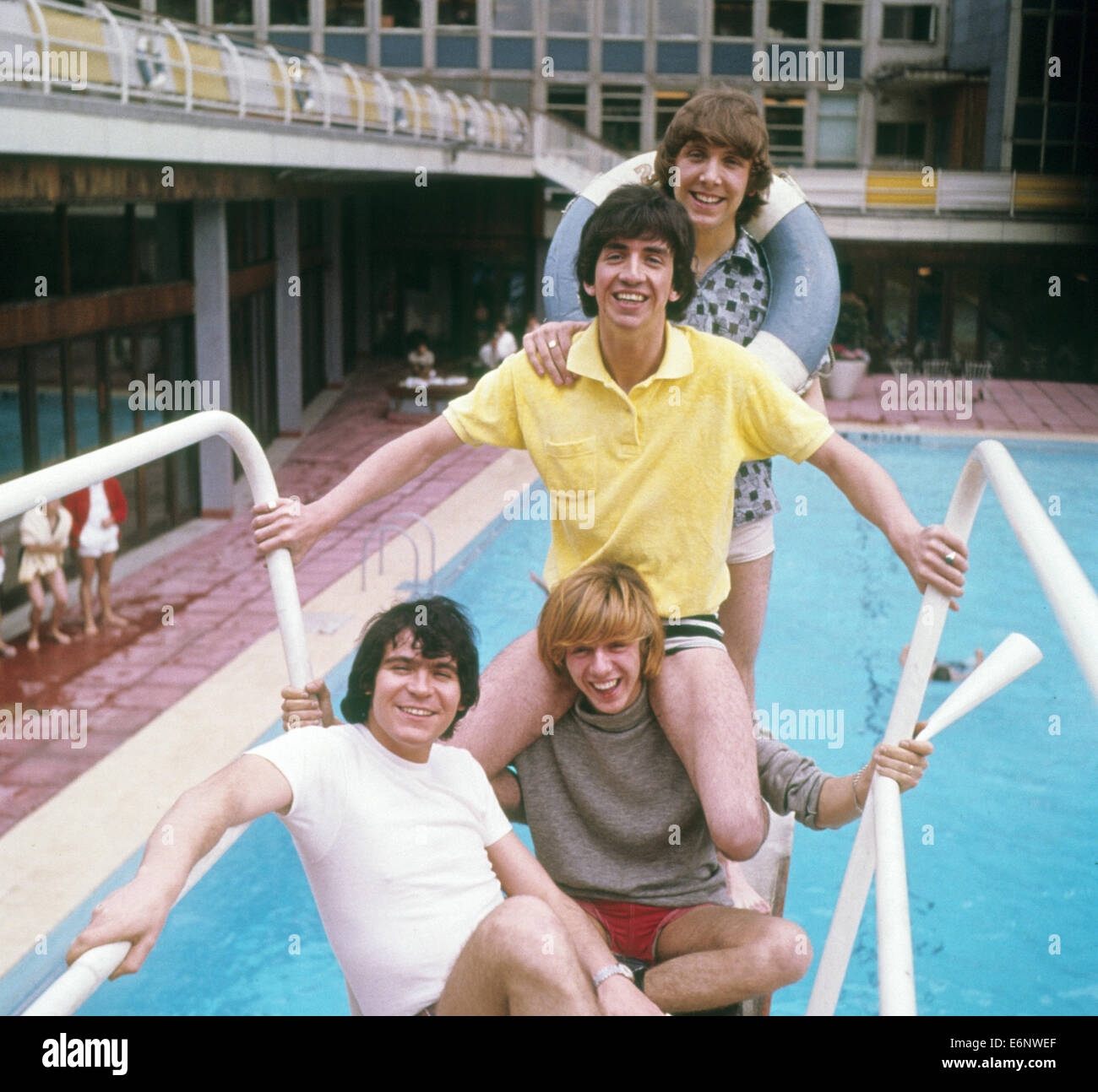 THE MERSEYBEATS UK pop group in 1965 with Tony Crane in yellow sitting ...