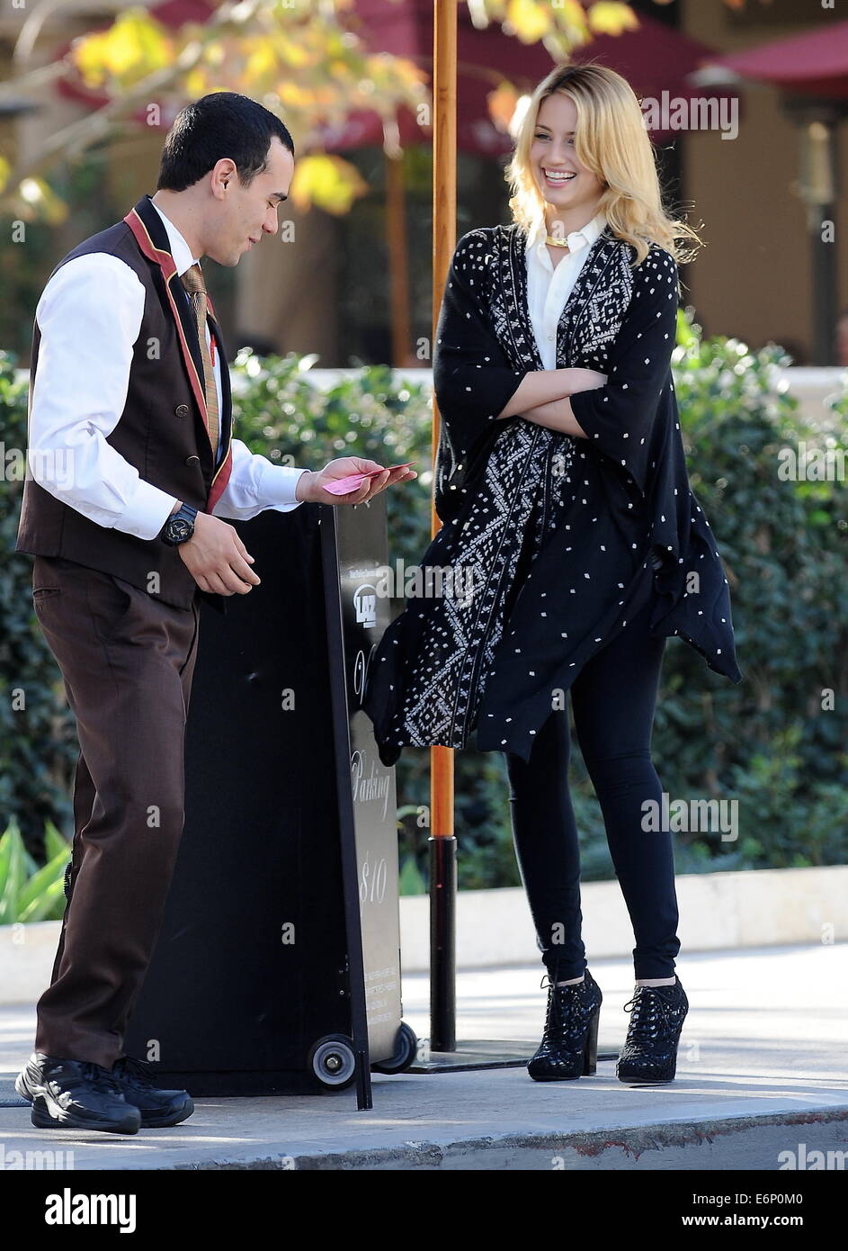 Glee star Dianna Agron is all smiles while waiting for her car at the ...