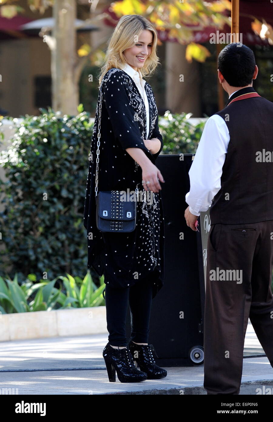 Glee star Dianna Agron is all smiles while waiting for her car at the ...