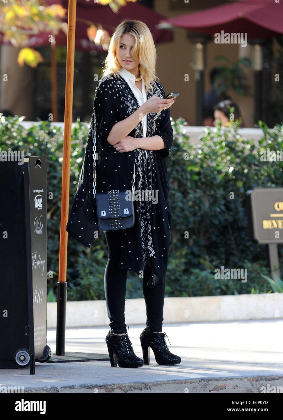 Glee star Dianna Agron is all smiles while waiting for her car at the ...