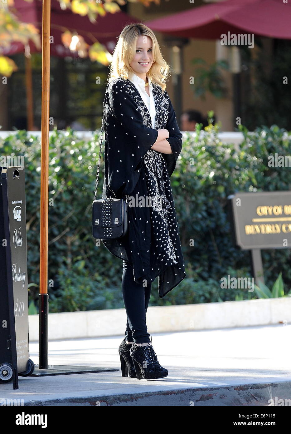 Glee star Dianna Agron is all smiles while waiting for her car at the ...