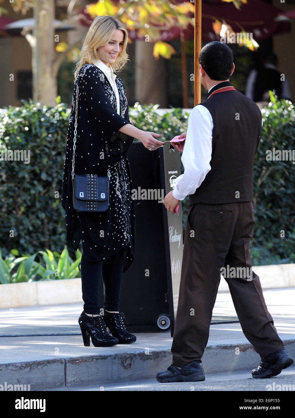 Glee star Dianna Agron is all smiles while waiting for her car at the ...
