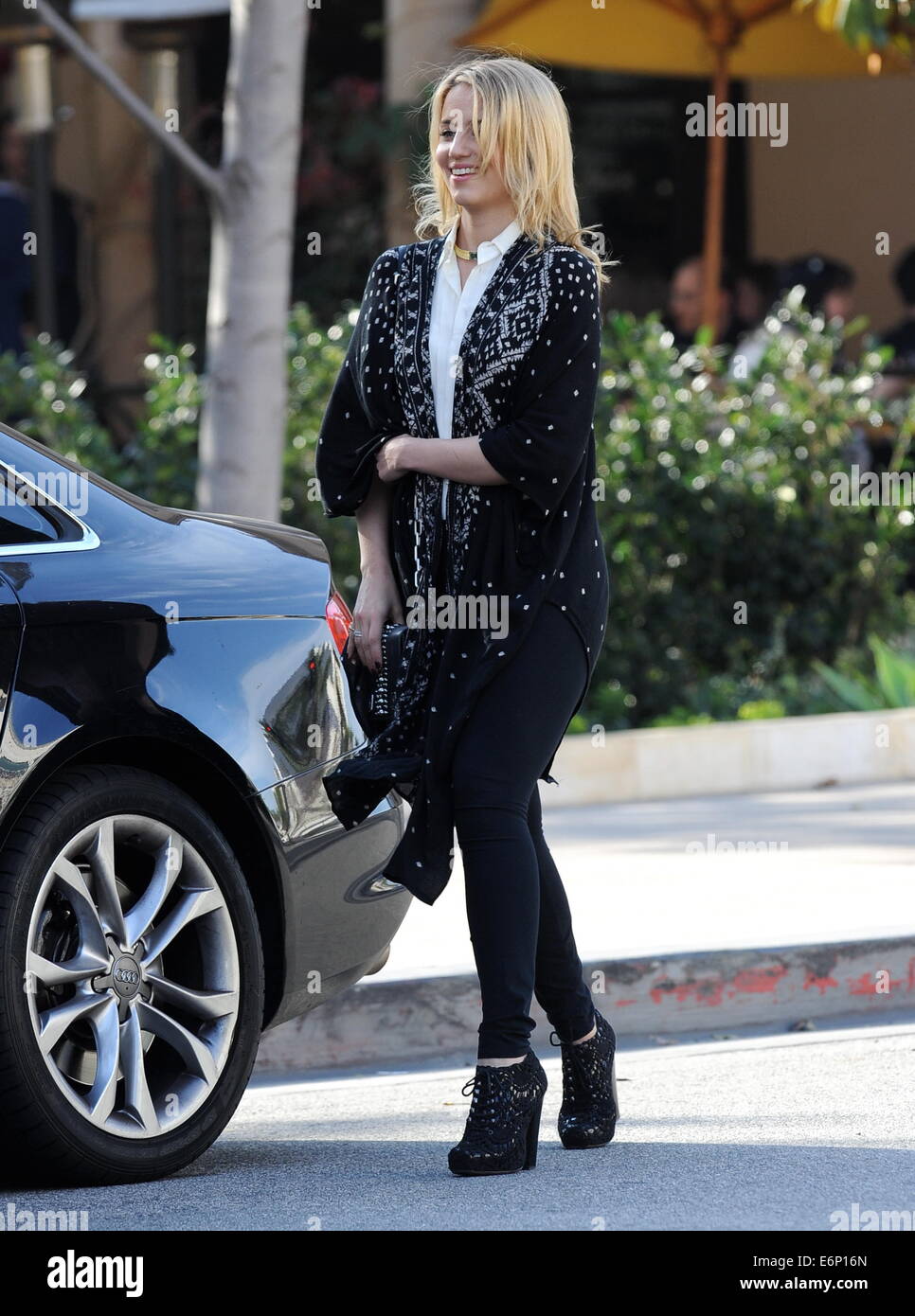 Glee star Dianna Agron is all smiles while waiting for her car at the ...