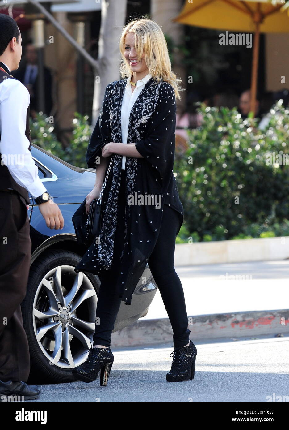 Glee star Dianna Agron is all smiles while waiting for her car at the ...
