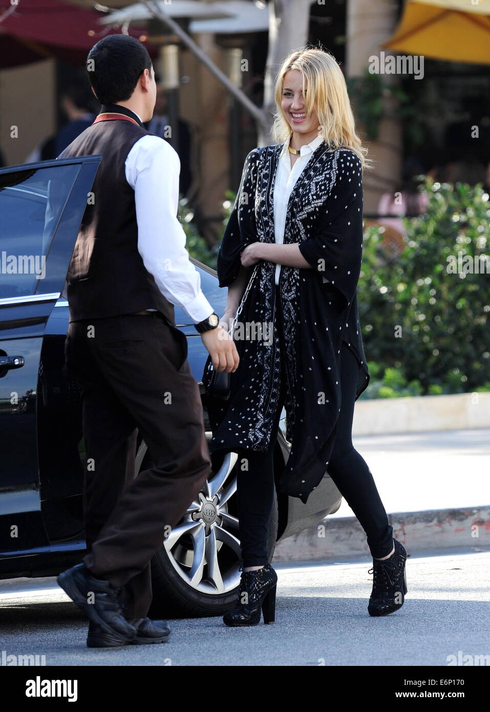 Glee star Dianna Agron is all smiles while waiting for her car at the ...