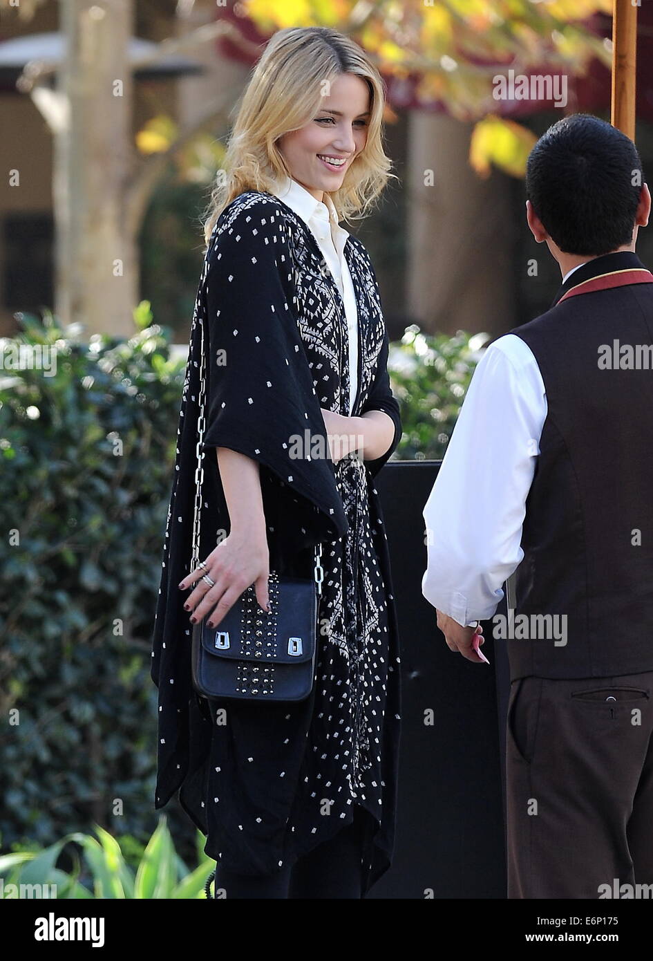 Glee star Dianna Agron is all smiles while waiting for her car at the ...