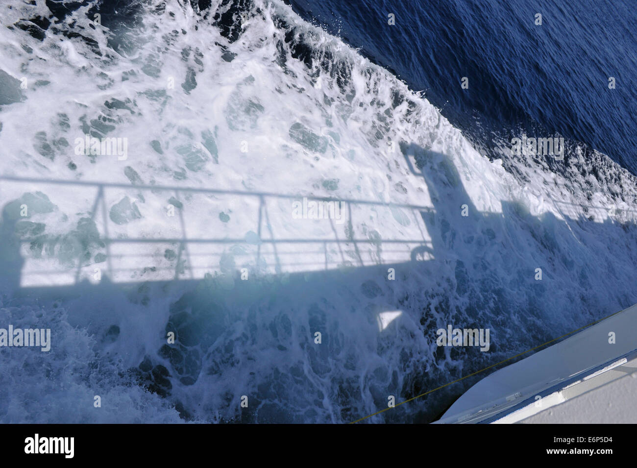 boat shadow on wake of ship foam Stock Photo - Alamy