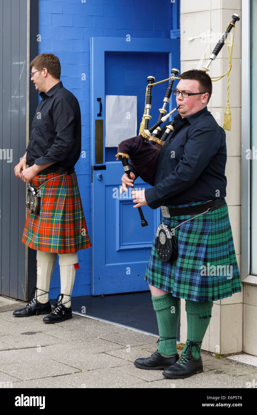 Male scottish bagpipe player wearing kilt outside Skipinnish Ceilidh ...