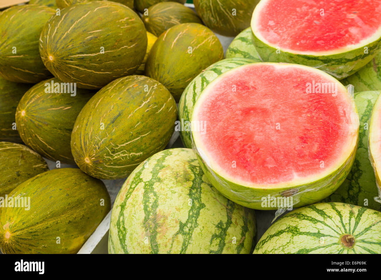 Assorted fresh melons on a street market stall Stock Photo - Alamy
