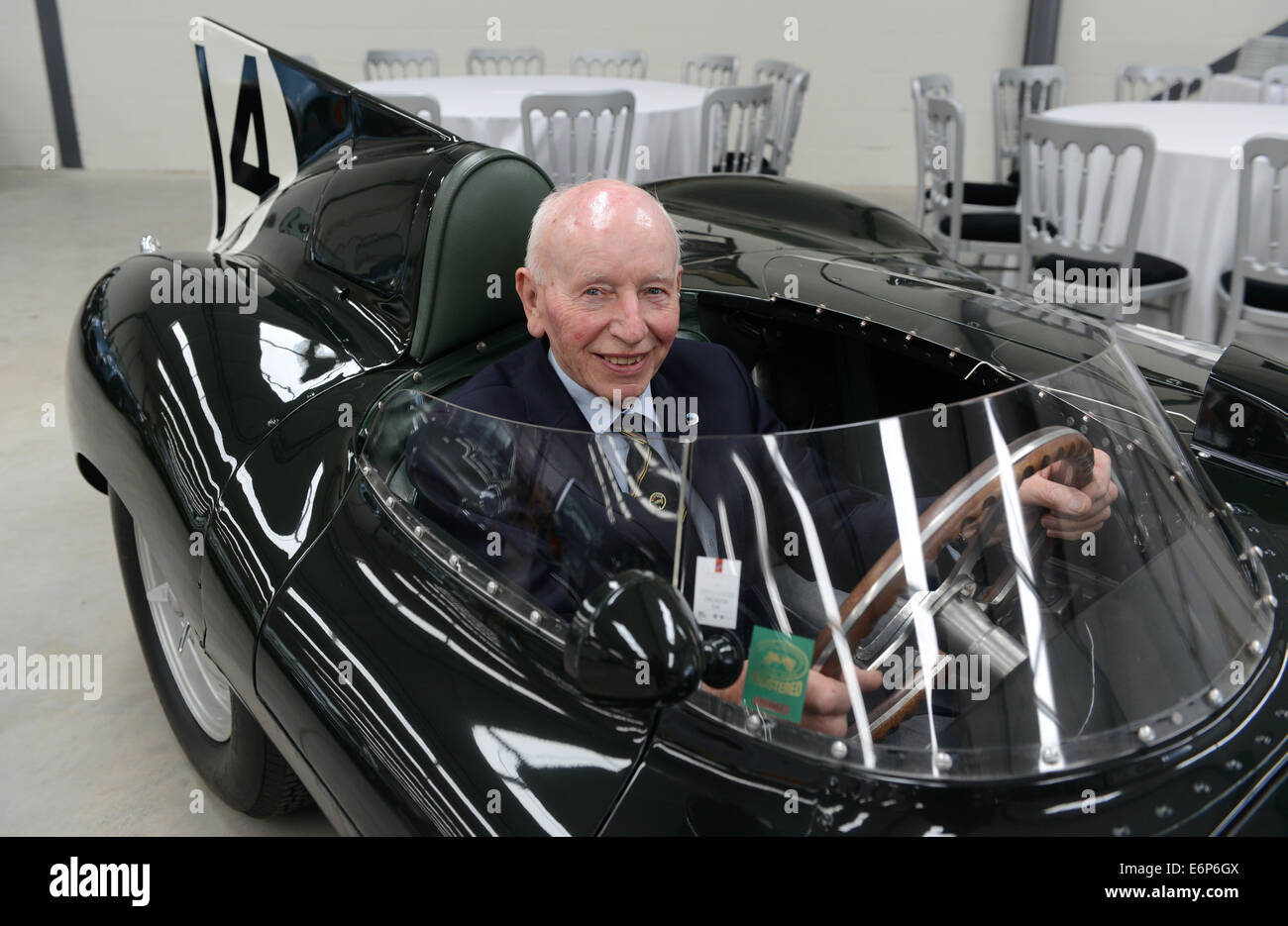 John Surtees the former Formula One World Champion behind the wheel of ...