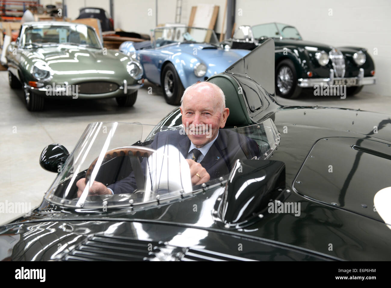 John Surtees the former Formula One World Champion behind the wheel of ...