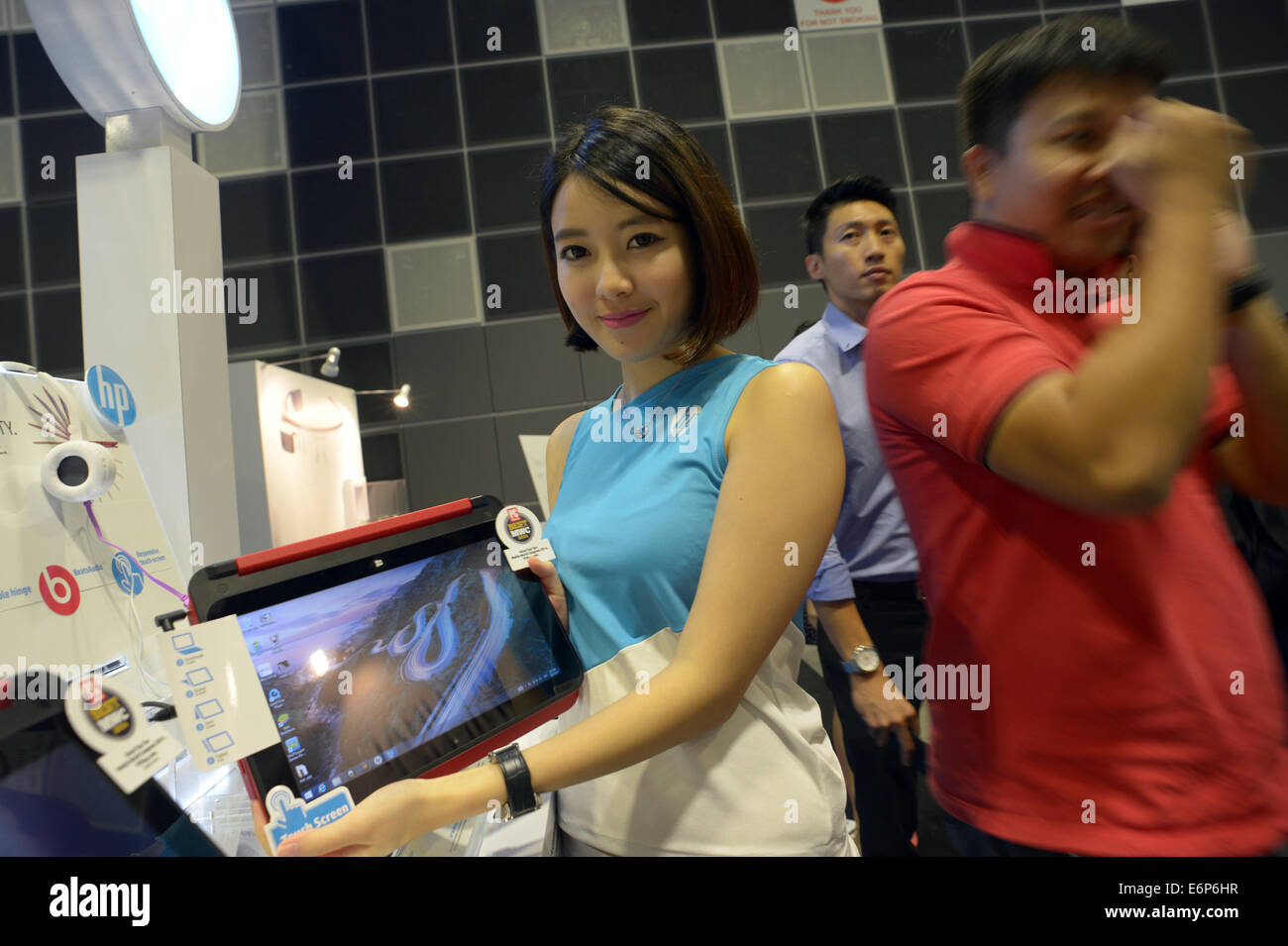 Singapore. 28th Aug, 2014. A model shows a product during the COMEX ...