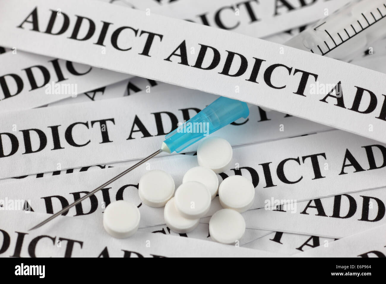 Syringe, pills and paper with the words "Addict". Concept Image ...