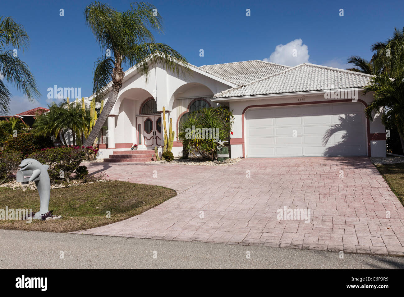 Front of Upscale Florida Suburban Home with Driveway and Two Car Garage ...