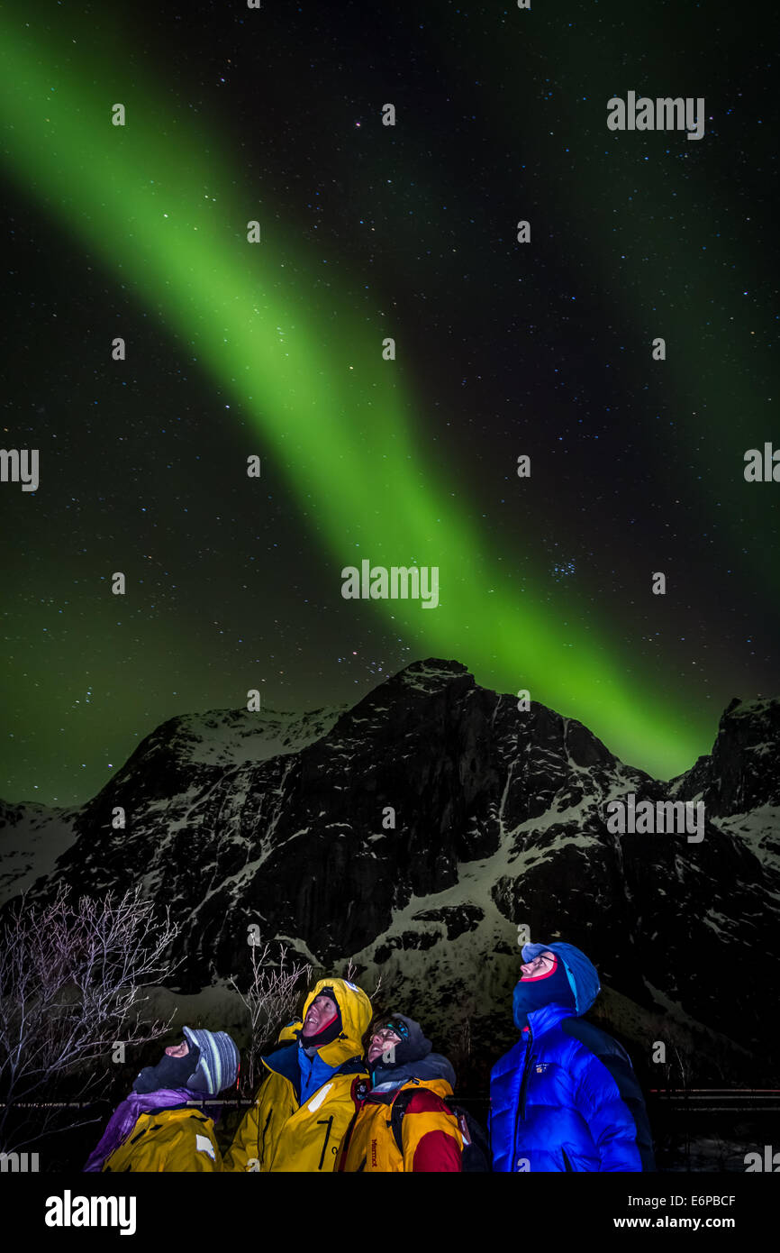 Family enjoying the Northern Lights show in Norway Stock Photo - Alamy