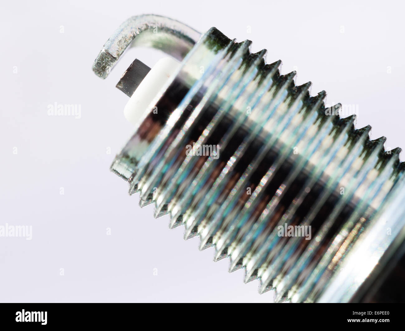 Auto service. New car spark plug as spare part of auto transportation ...