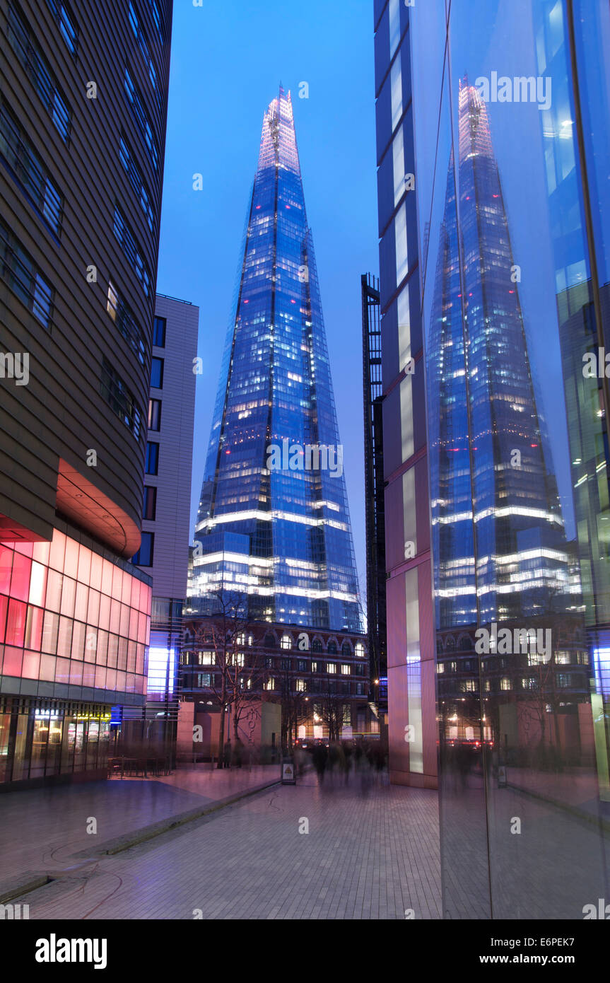 The Shard reflecting in the windows of the modern office buildings of ...