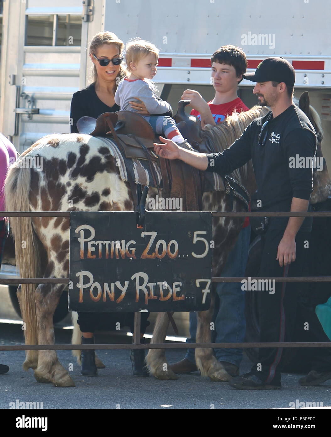 Elizabeth Berkley takes her son, Sky for a pony ride at the farmers ...