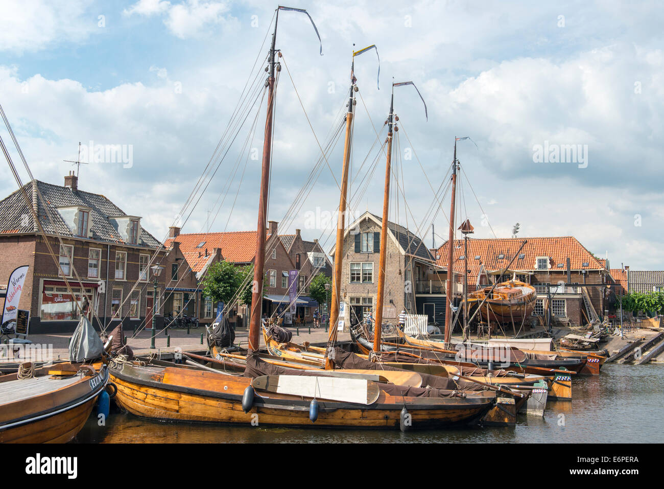Botters, a type of historical fishing boat, dockyard in the background ...