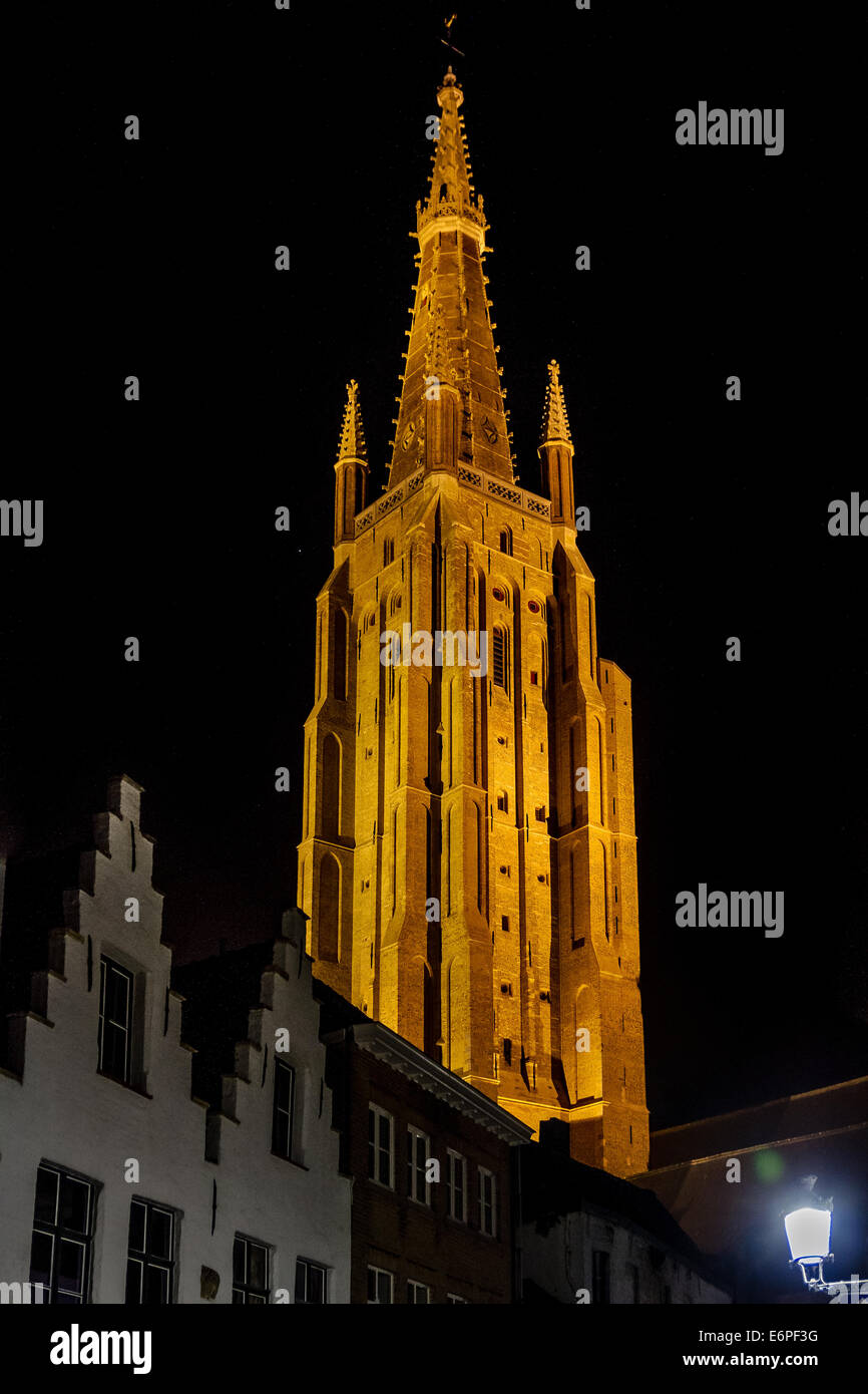 Tower of the medieval Church of our Lady in Bruges Belgium illuminated ...