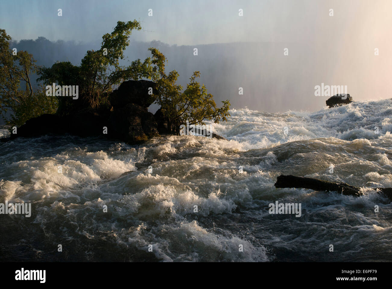Sunset in the Victoria Falls. Victoria Falls is the result of soft ...