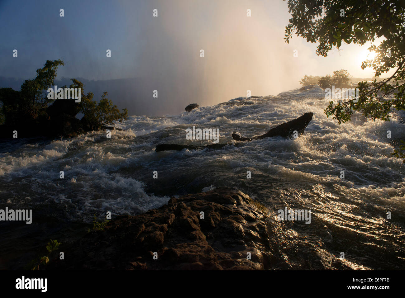 Sunset in the Victoria Falls. Victoria Falls is the result of soft ...