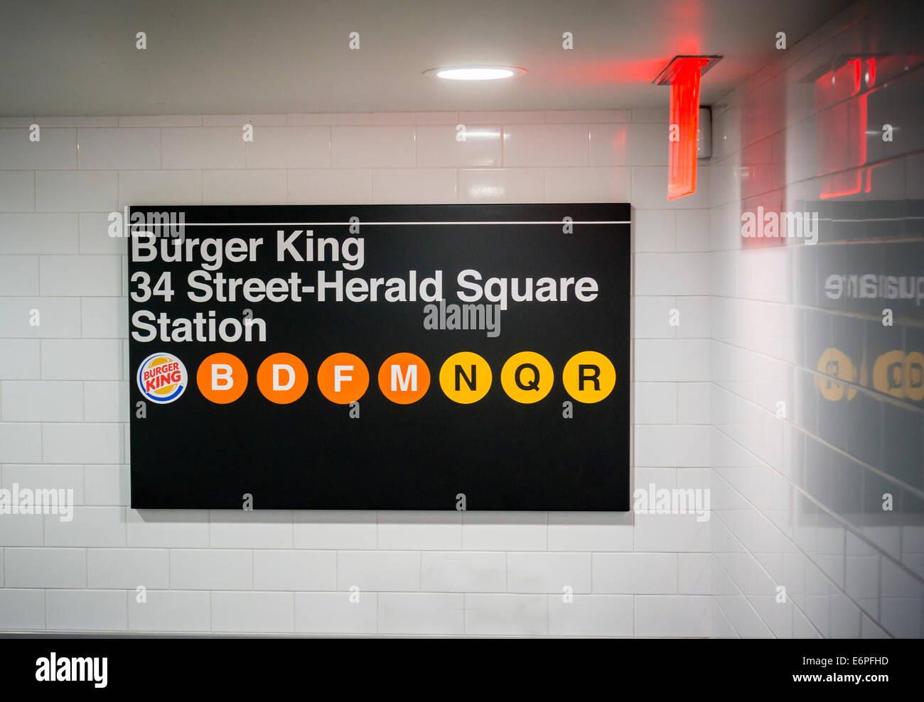 A Burger King fast food restaurant is co-branded with a subway entrance ...