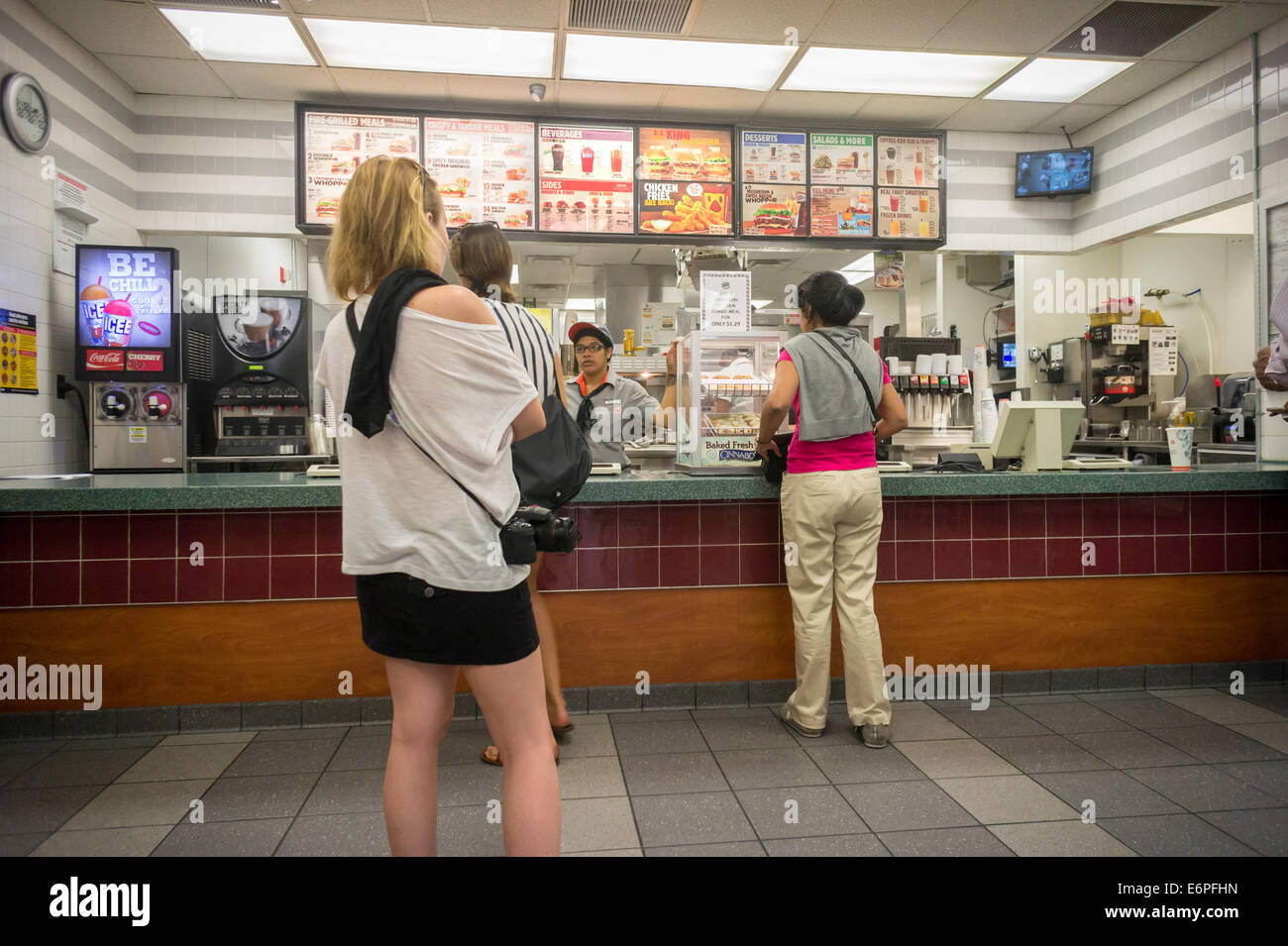 Customers at the counter of a Burger King fast food restaurant in New ...