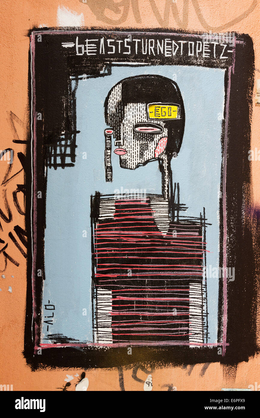 Colourful graffiti of a computer or robot woman on a façade in the ...