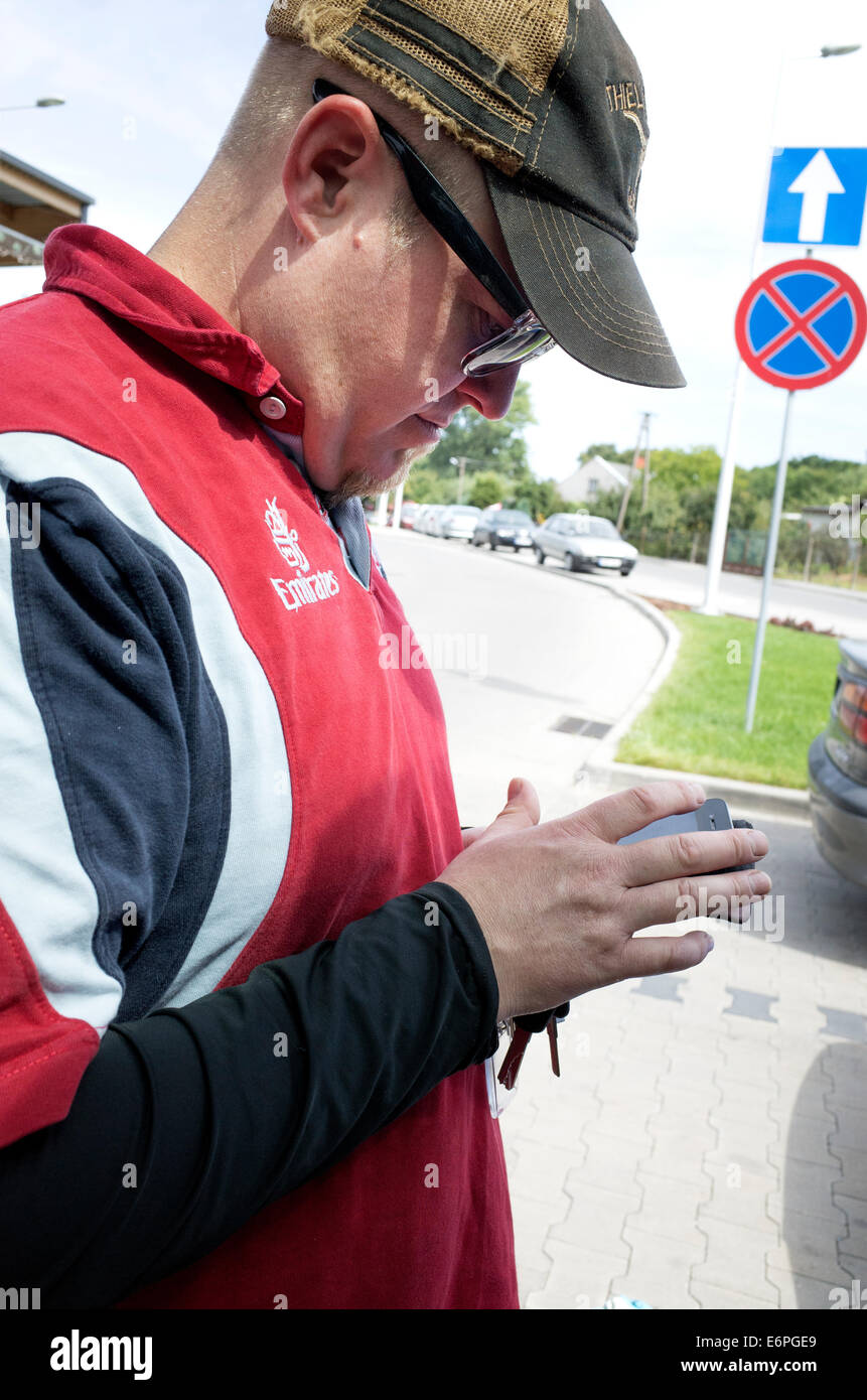 Man age 39 totally absorbed while texting on his mobile cell phone ...