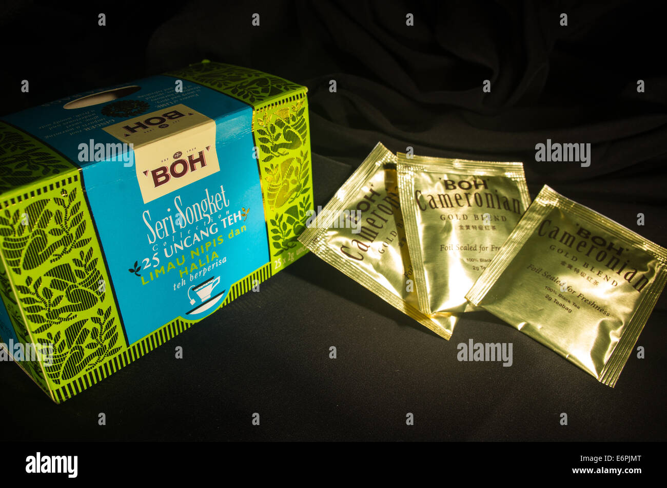 a box and few packet of key lime and ginger flavoured seri songket boh ...