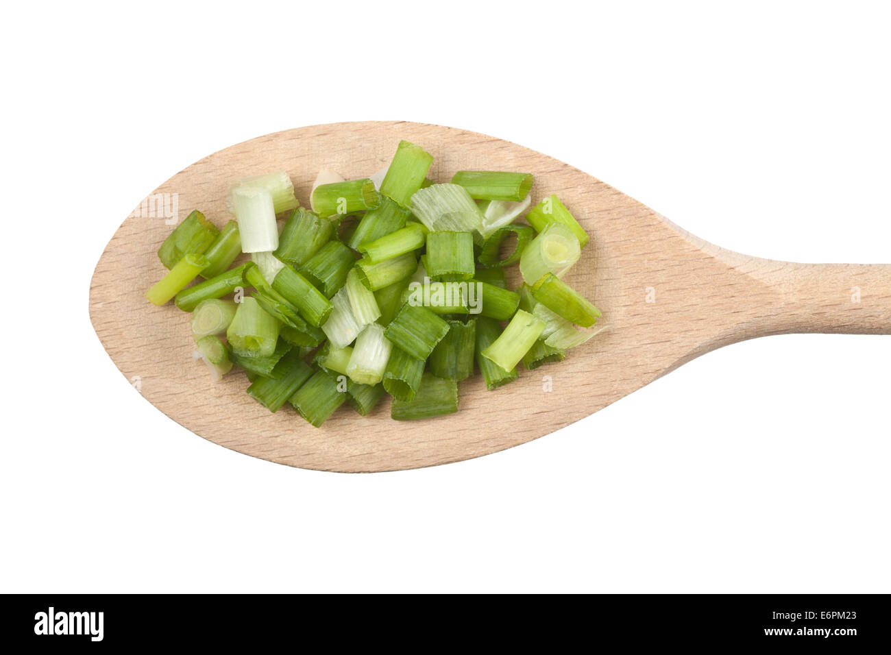 Chopped spring onion on wooden spoon isolated on white background Stock ...