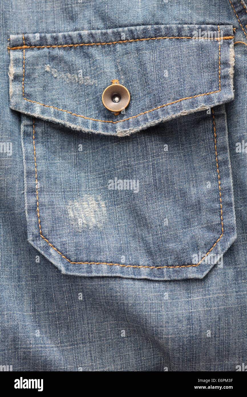 Denim shirt pocket. Focus on button Stock Photo - Alamy